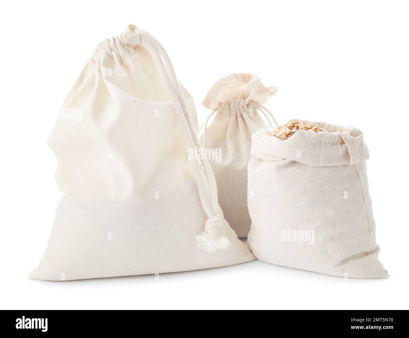 Cotton eco bags with oat flakes isolated on white Stock Photo - Alamy