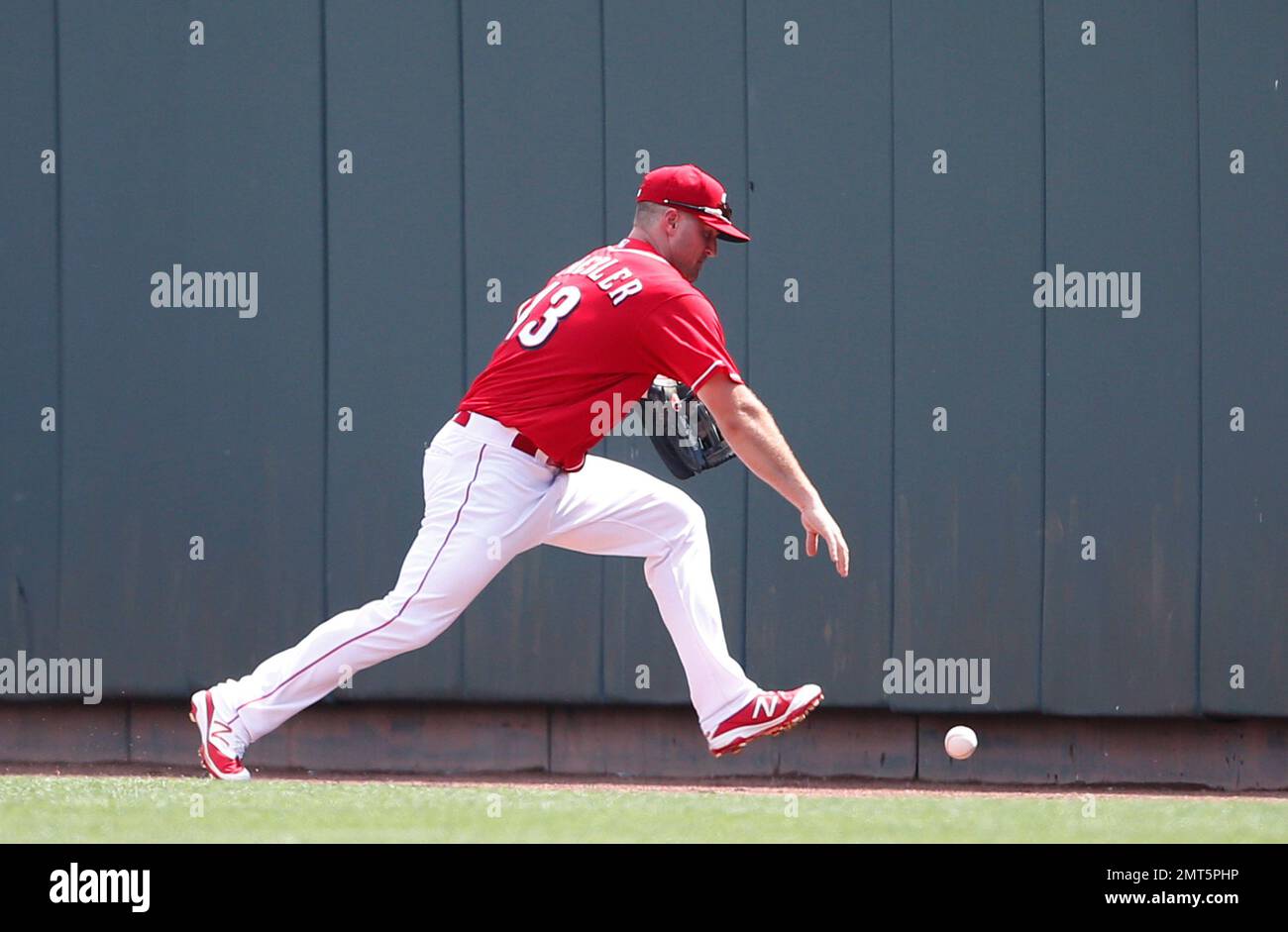 Cincinnati Reds right fielder Scott Schebler (43) chases a ball off the ...