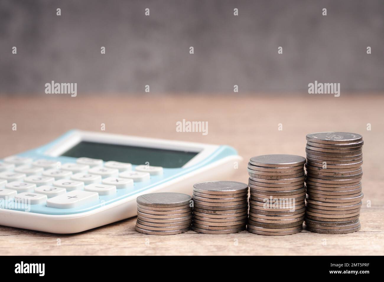 Money with calculator on brown background.Cost calculation concept ...