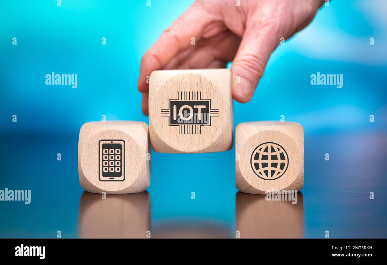 Wooden blocks with symbol of iot concept on blue background Stock Photo ...