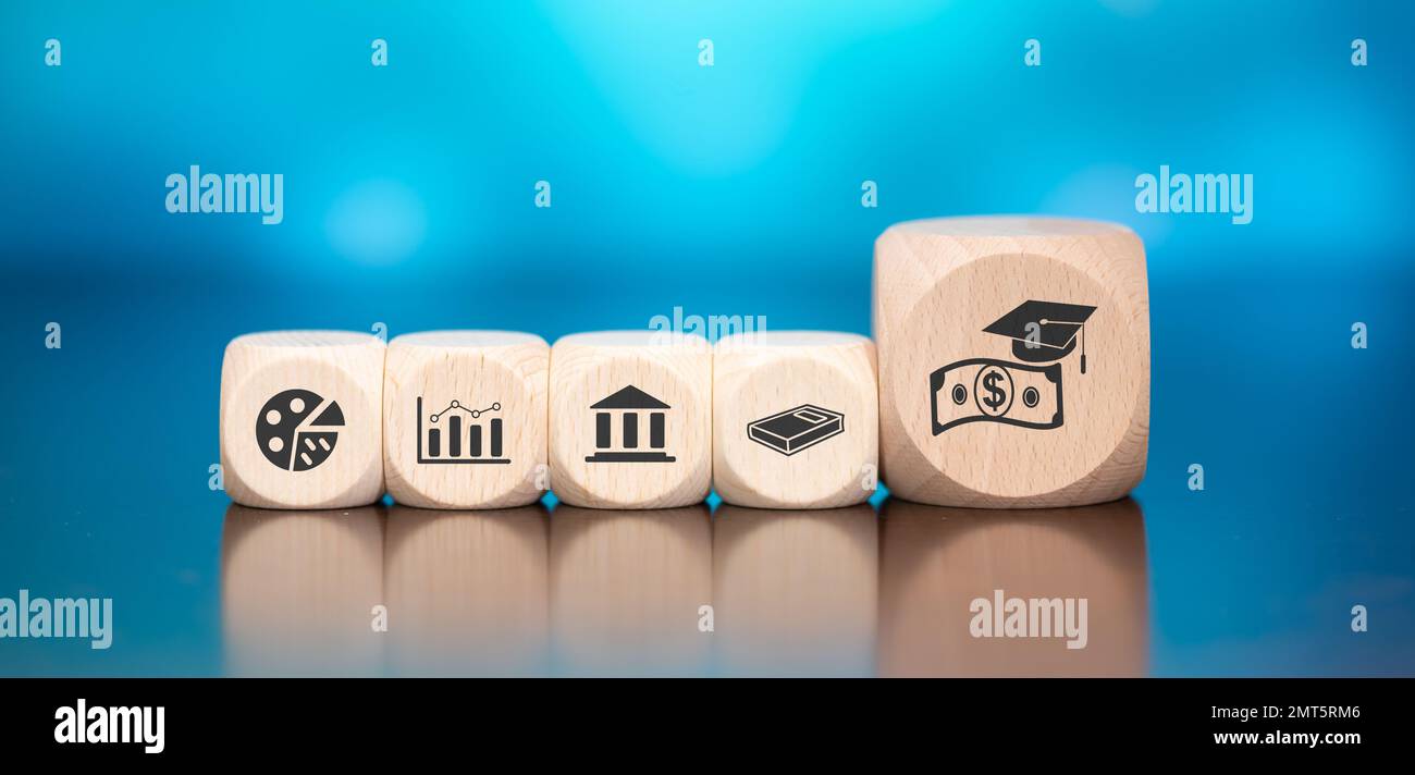 Wooden blocks with symbol of fafsa concept on blue background Stock ...