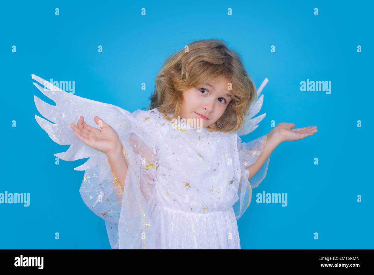 Little cute child at angel costume on isolated background. Kid with ...