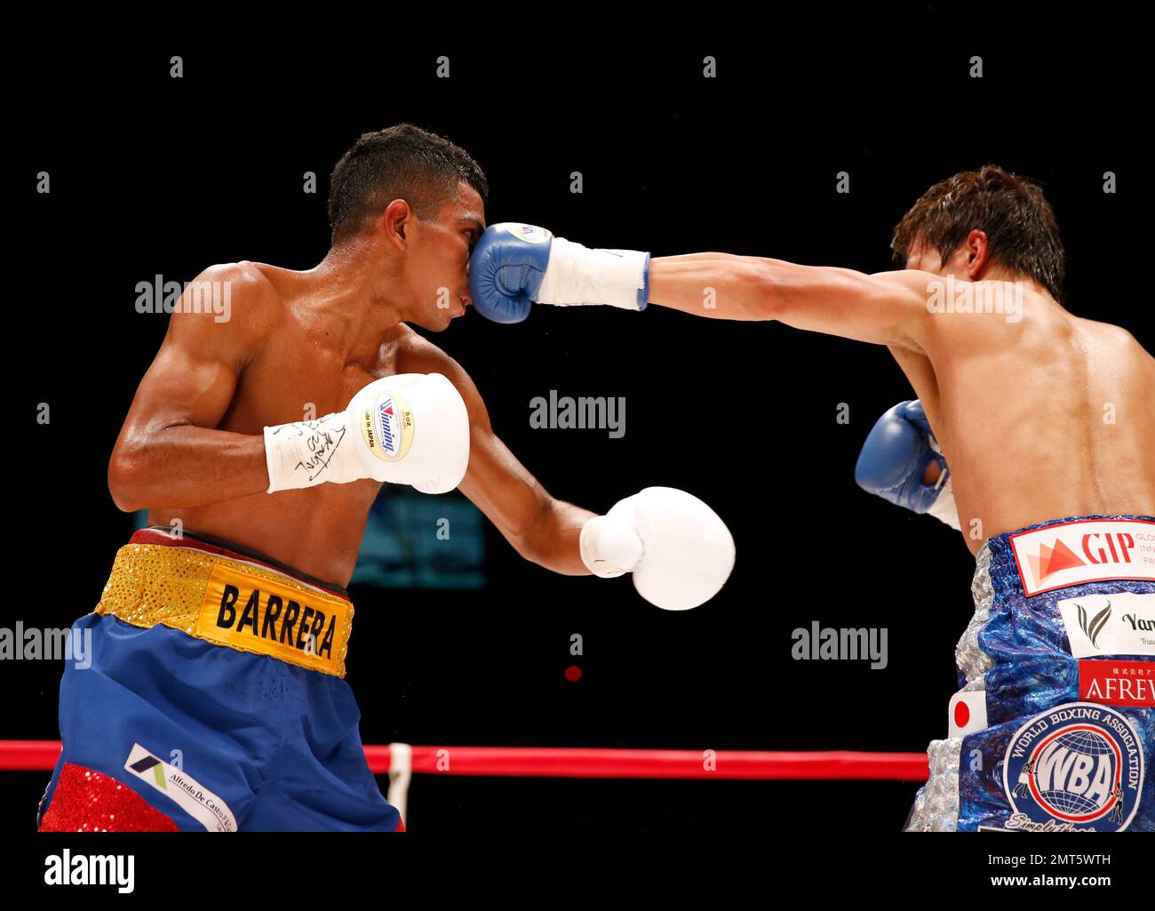 Japanese champion Ryoichi Taguchi, right, sends a left to Colombian ...