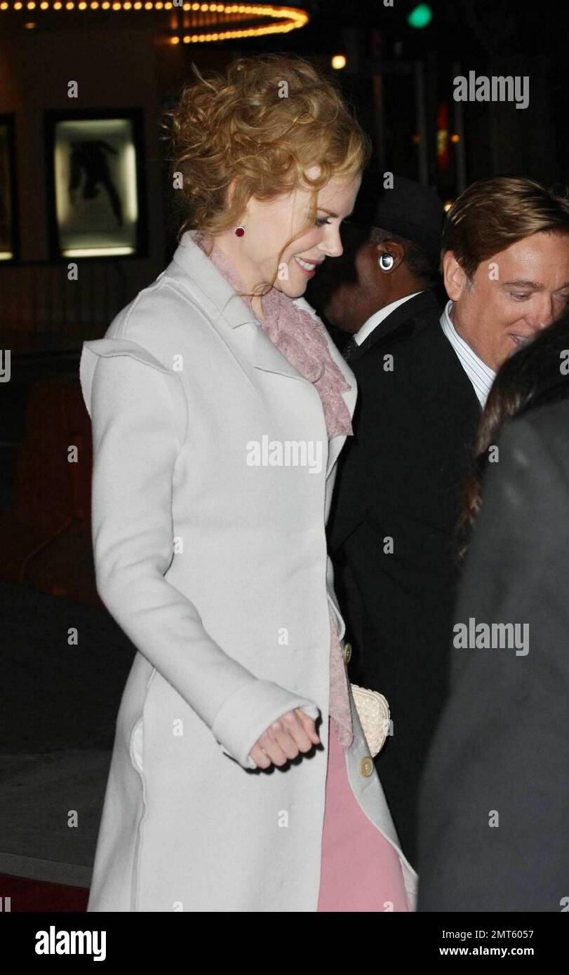 Nicole Kidman arrives at the premiere of NINE wearing a pink dress and ...