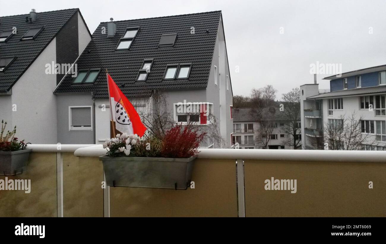 Flag with the Cologne city coat of arms flies on a balcony in winter ...