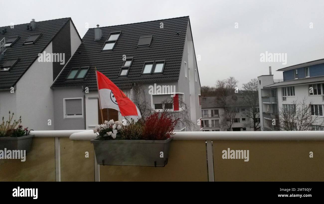 Flag with the Cologne city coat of arms flies on a balcony in winter ...