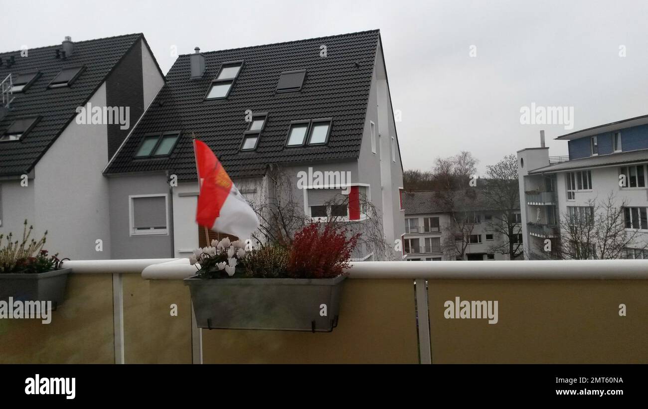Flag with the Cologne city coat of arms flies on a balcony in winter ...