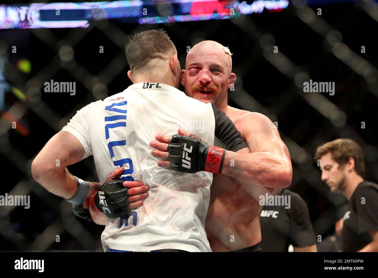 Gian Villante hugs Patrick Cummins after their mixed martial arts bout ...