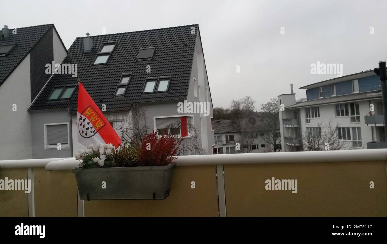 Flag with the Cologne city coat of arms flies on a balcony in winter ...