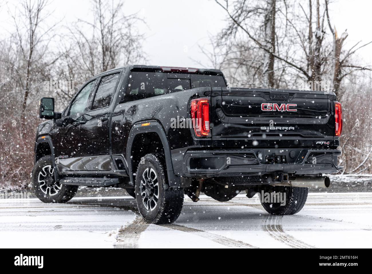 A rear view of a black 2020 GMC Sierra pickup truck in the snow Stock ...