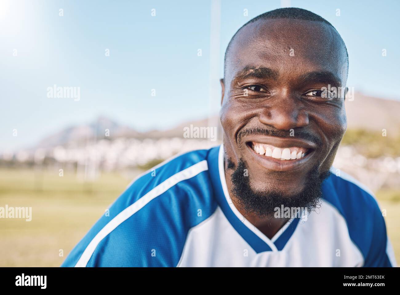 Portrait of black man with smile on face, football and sports mindset ...