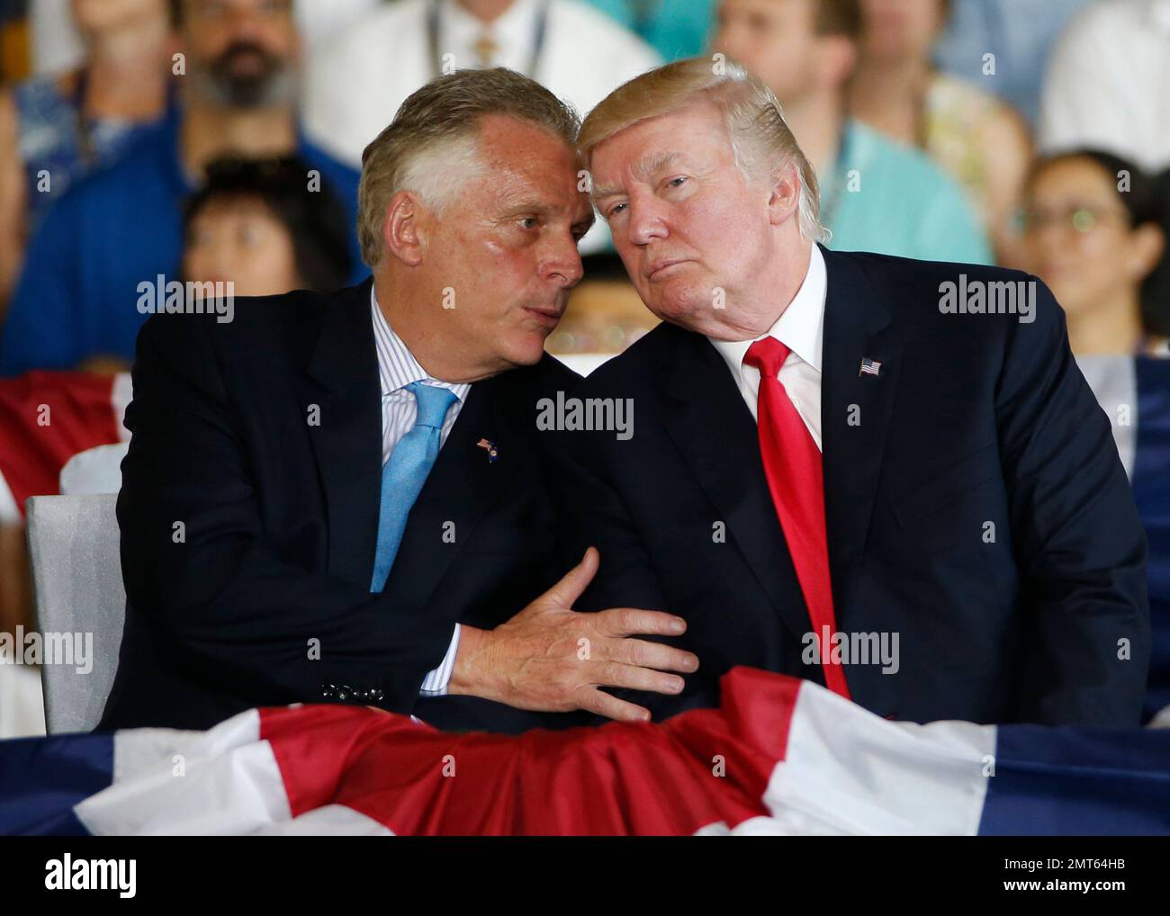 President Donald Trump, right, talks with Virginia Gov. Terry McAuliffe ...