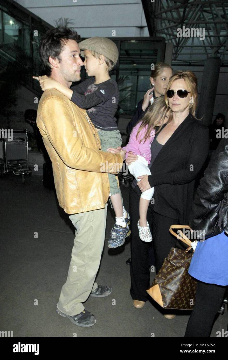 "ER" star Noah Wylie and family arrive stateside at Los Angeles ...