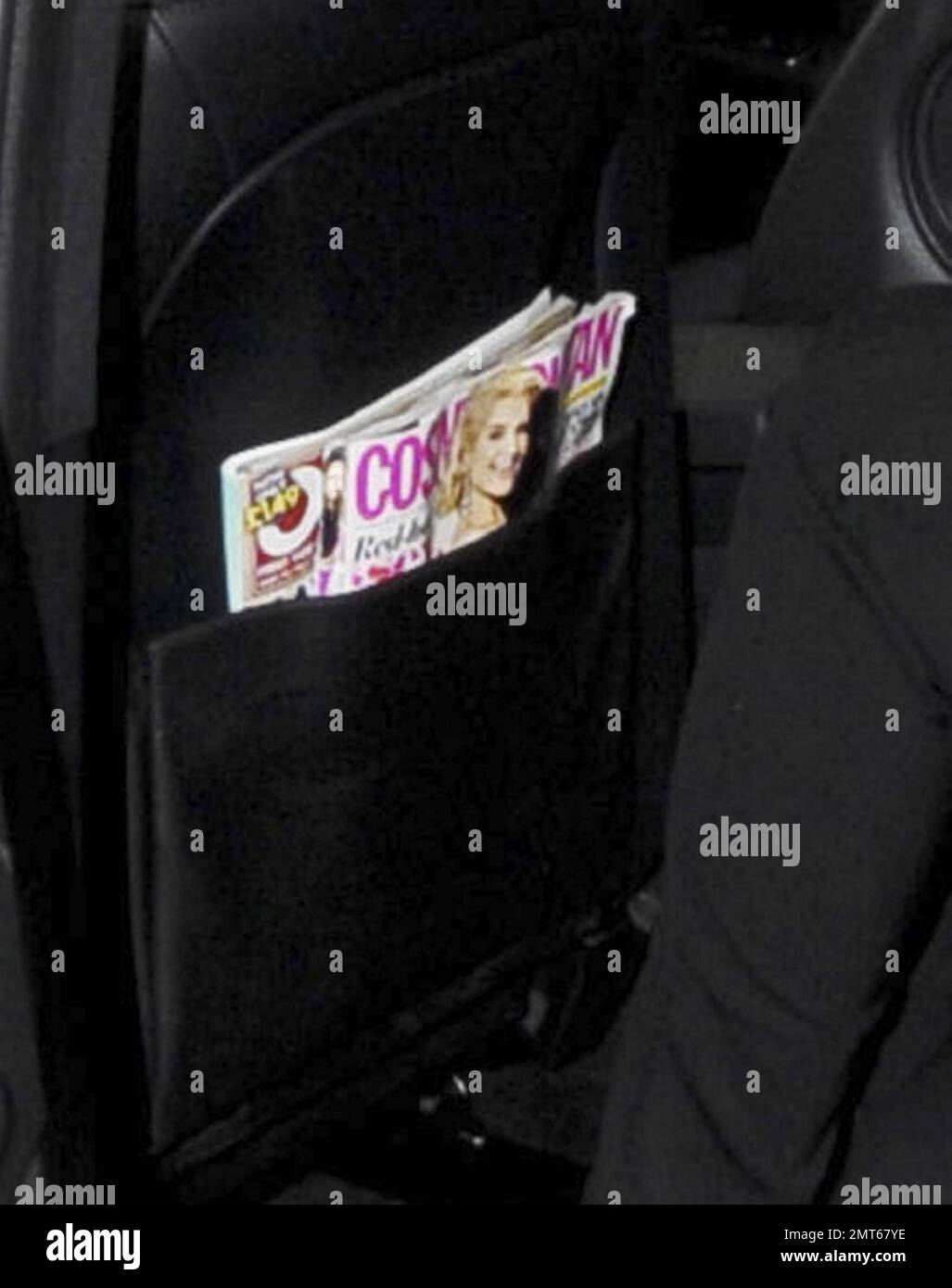 In a sleek female tuxedo, white blouse and platform stilettos, Swedish ...