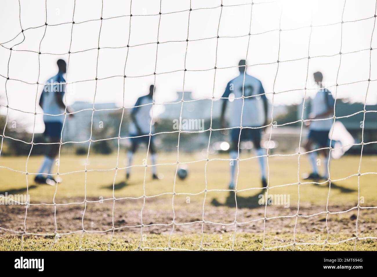 Goal post, field and football players training for sports energy ...