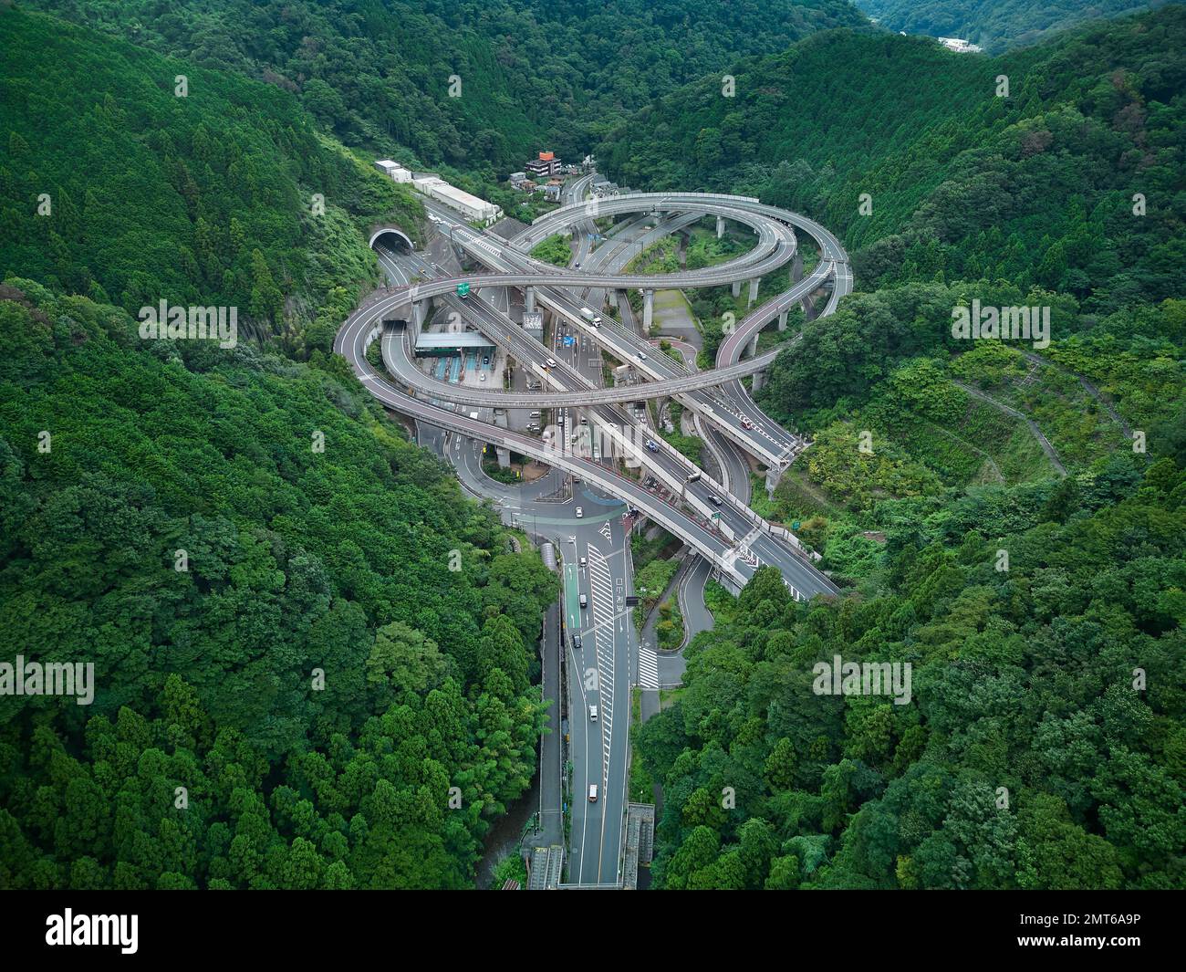 an aerial shot of A highway interchange in the Takao Mountain, near ...