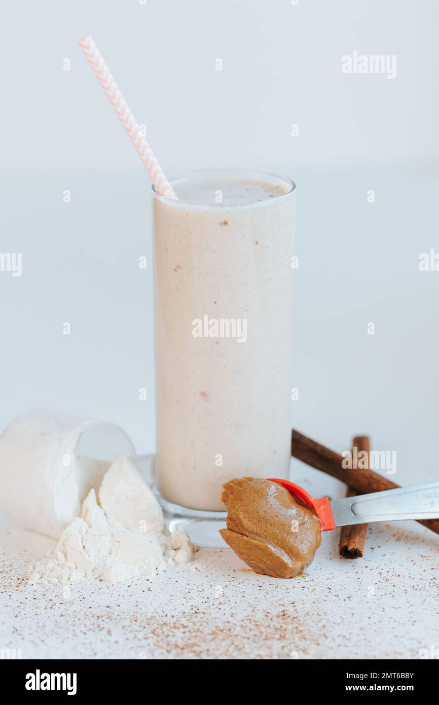 A vertical of the fresh milkshake with cookies isolated on the empty ...