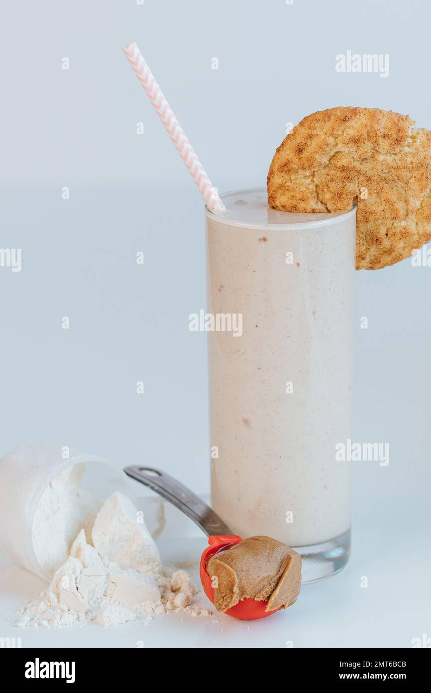 A vertical of the fresh milkshake with cookies isolated on the empty ...