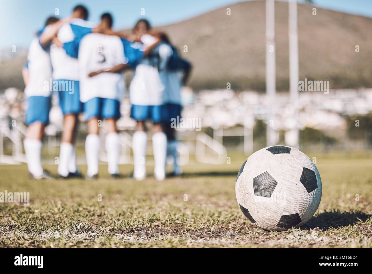 Ball, sports field and team huddle, game and training for competition ...