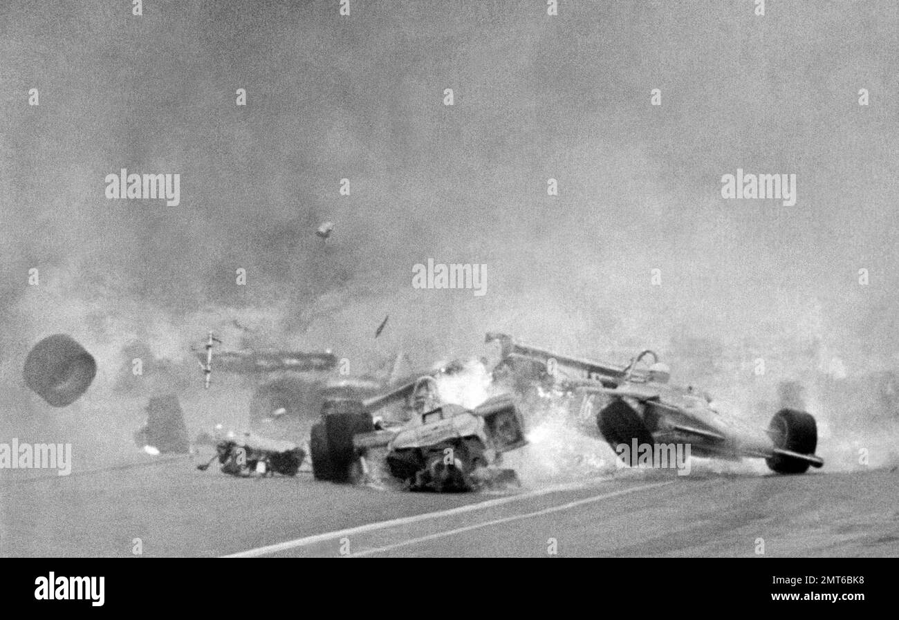 The burning car of Salt Walther, center, spins upside down with the ...