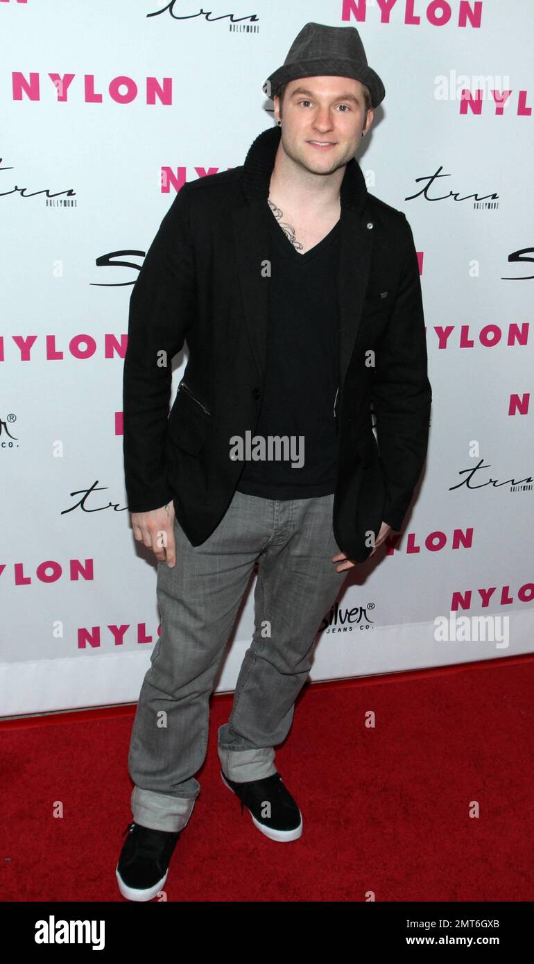 Singer Blake Lewis poses for photographers on the red carpet at NYLON ...
