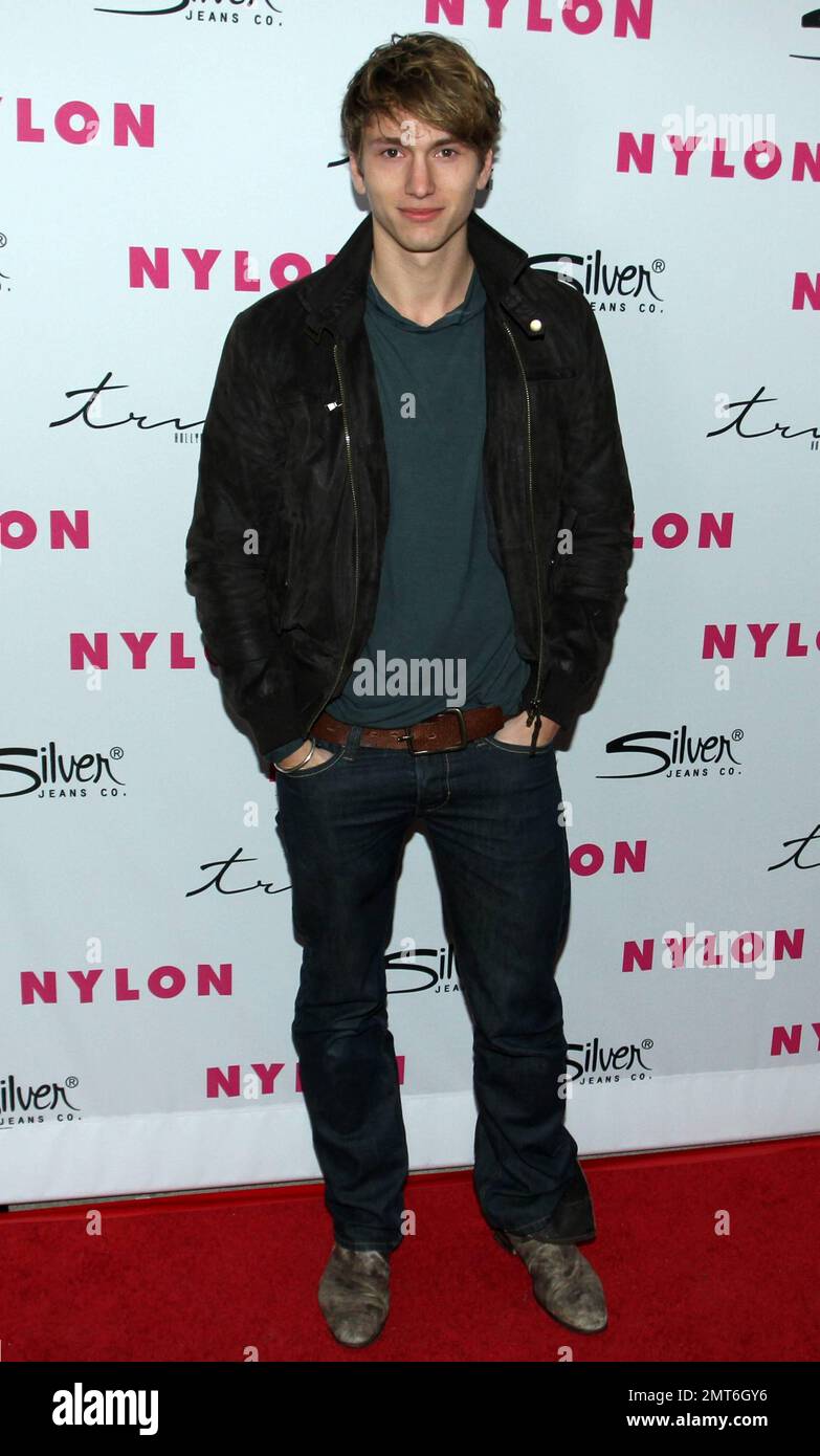 Actor Benjamin Stone poses for photographers on the red carpet at NYLON ...