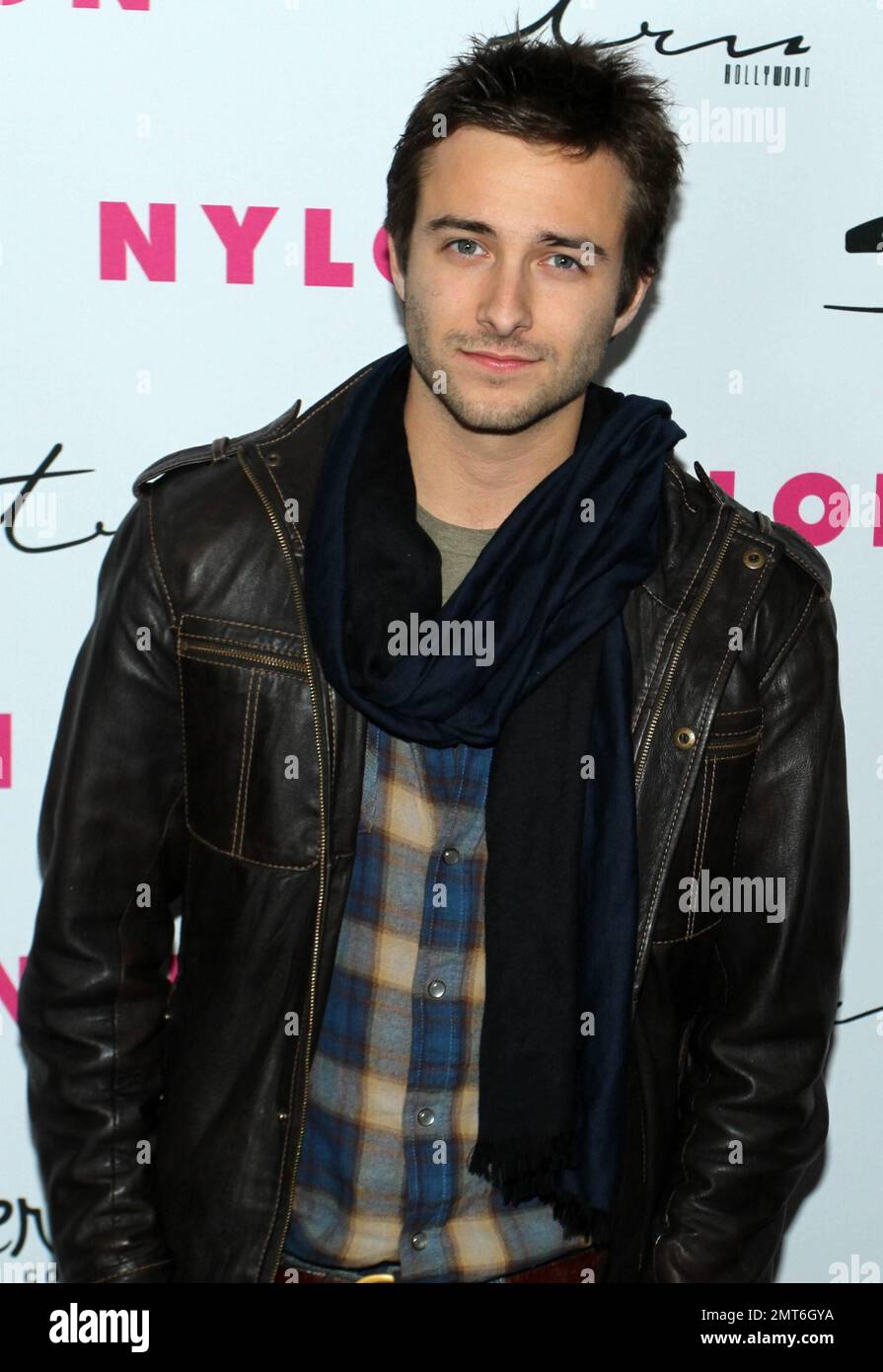 Actor Reese Thompson poses for photographers on the red carpet at NYLON ...