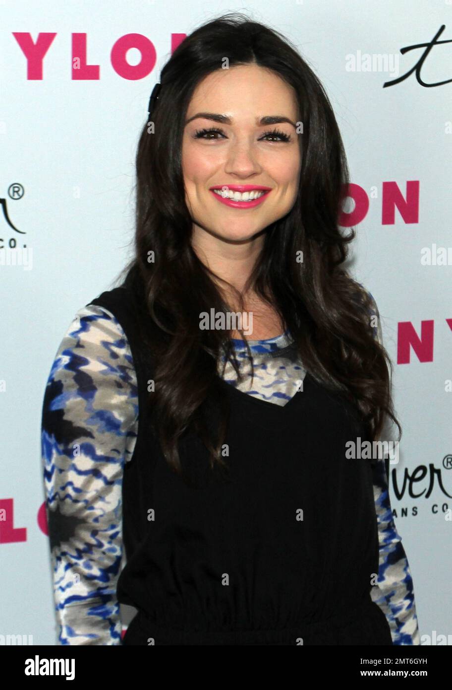 Actress Crystal Reed poses for photographers on the red carpet at NYLON ...