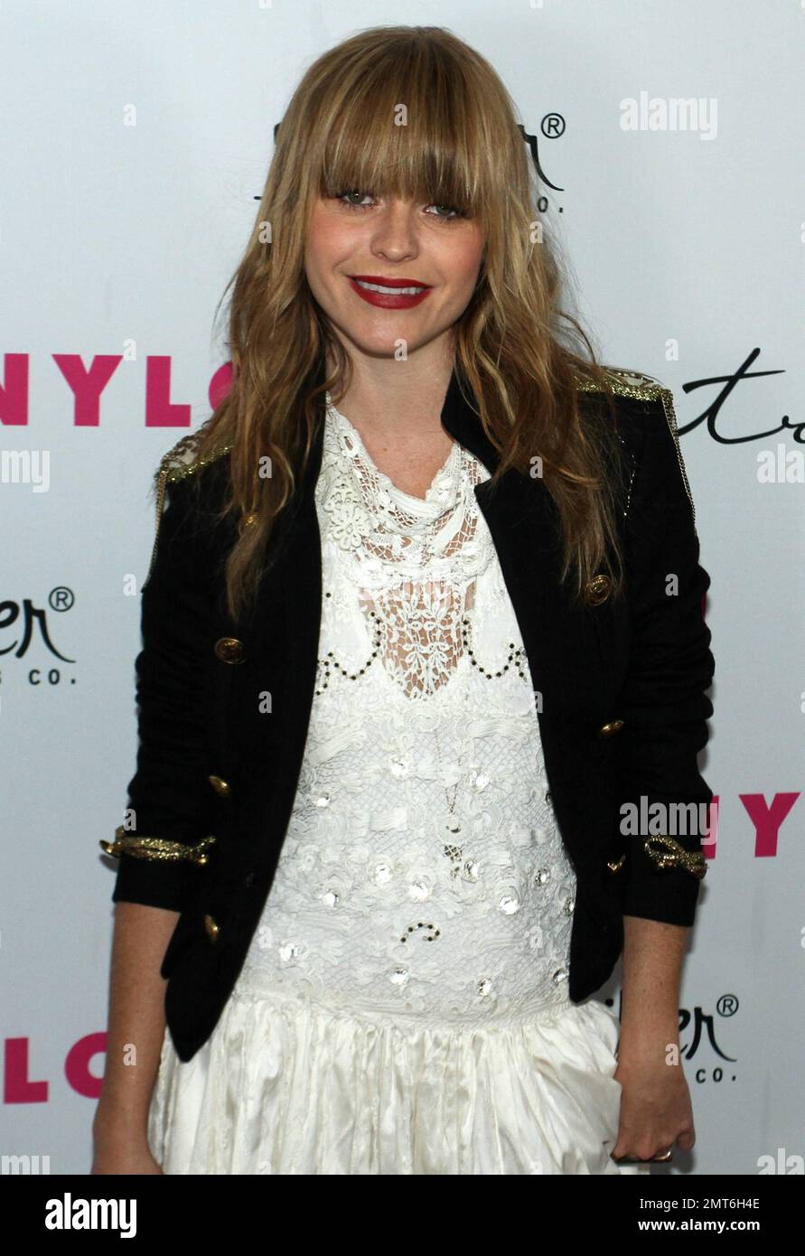 Taryn Manning poses for photographers on the red carpet at NYLON ...