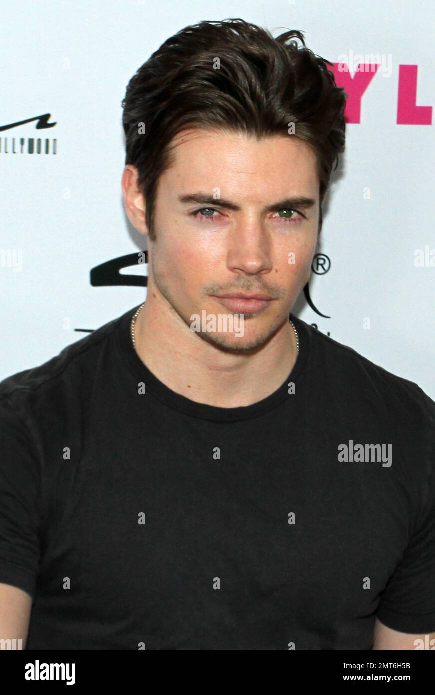 Actor Josh Henderson poses for photographers on the red carpet at NYLON ...