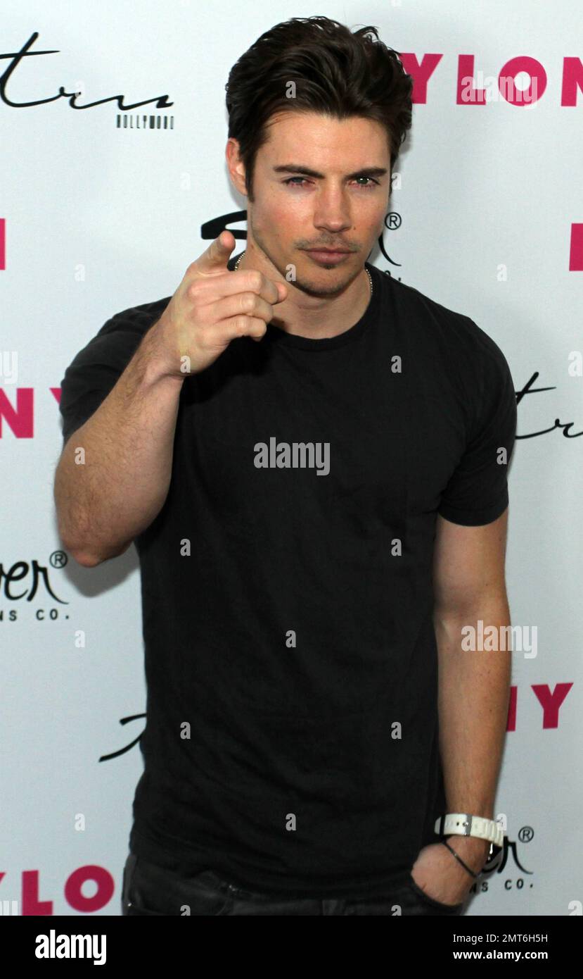 Actor Josh Henderson poses for photographers on the red carpet at NYLON ...