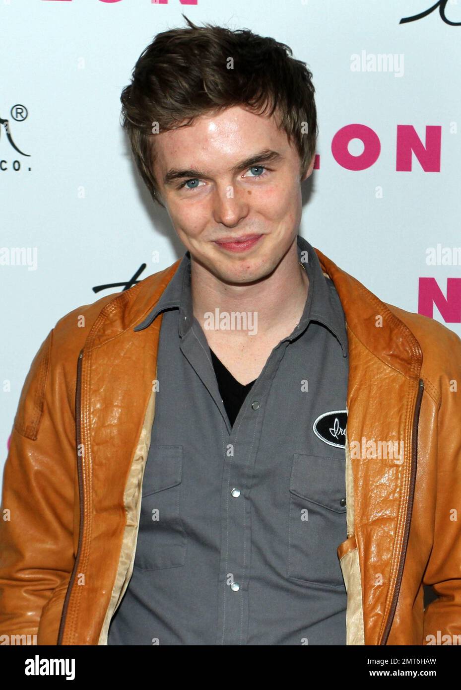 Actor Tyler Johnston poses for photographers on the red carpet at NYLON ...