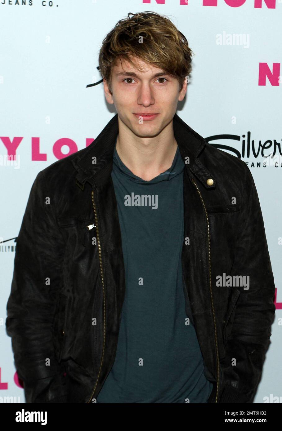 Actor Benjamin Stone poses for photographers on the red carpet at NYLON ...