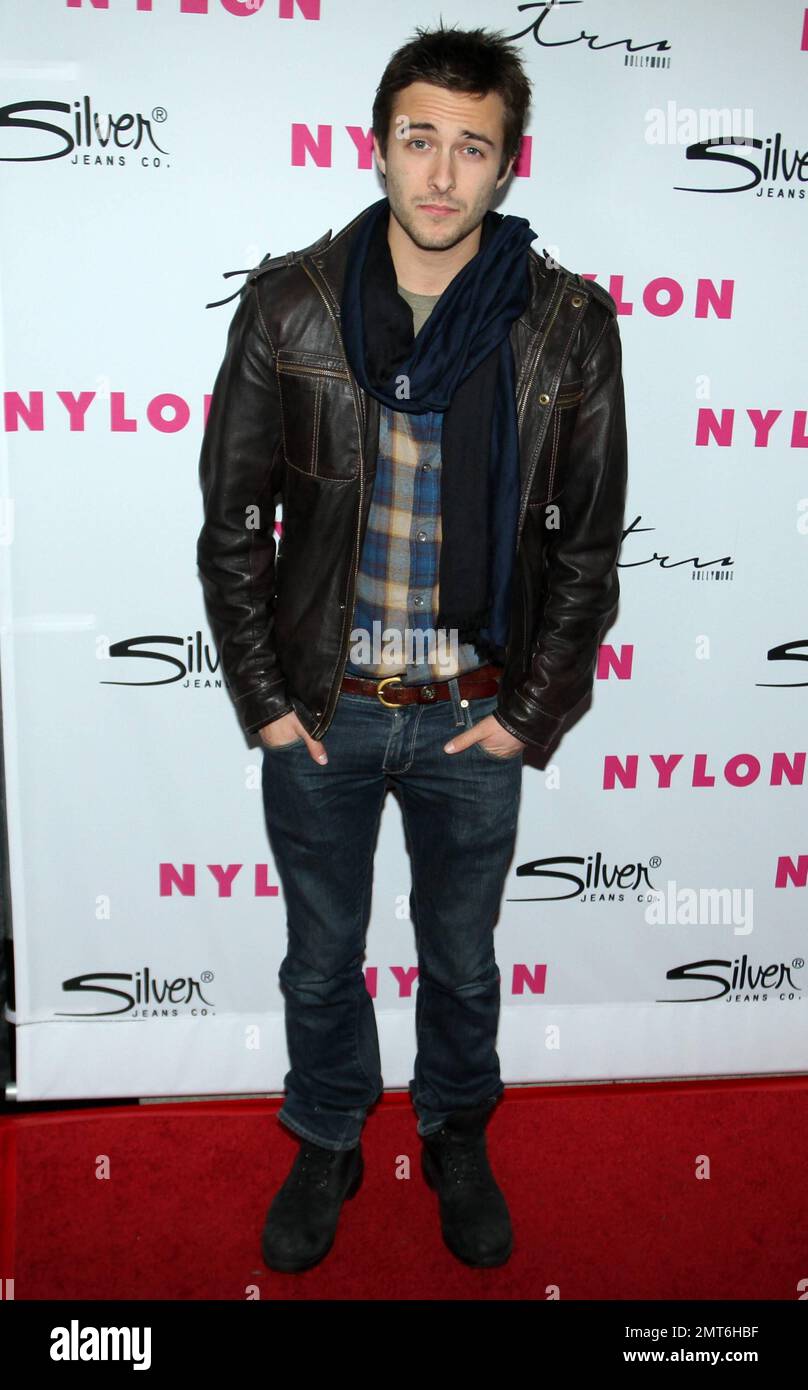 Actor Reese Thompson poses for photographers on the red carpet at NYLON ...