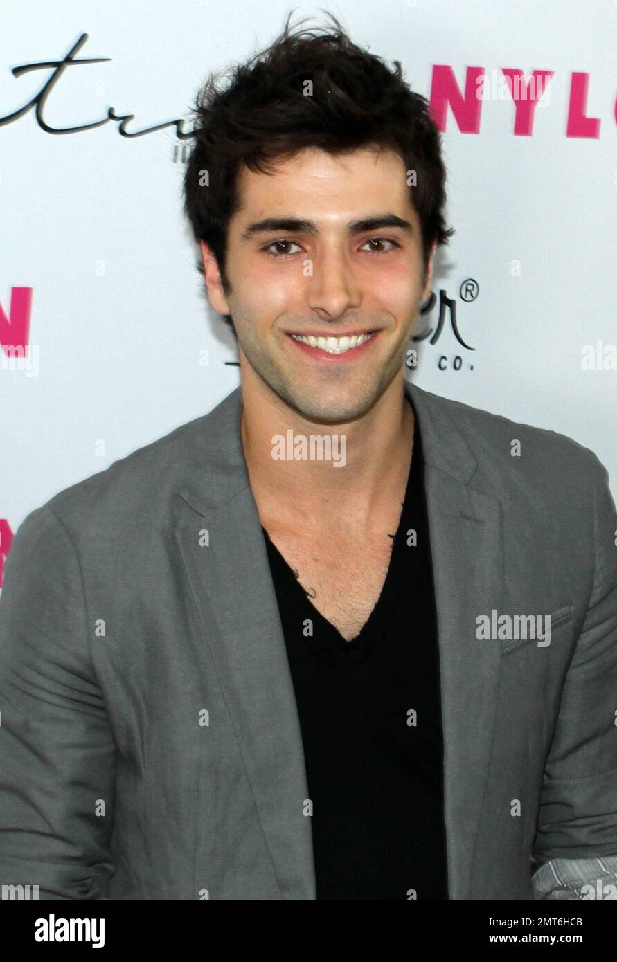 Actor Freddie Smith poses for photographers on the red carpet at NYLON magazineÕs 12th ...