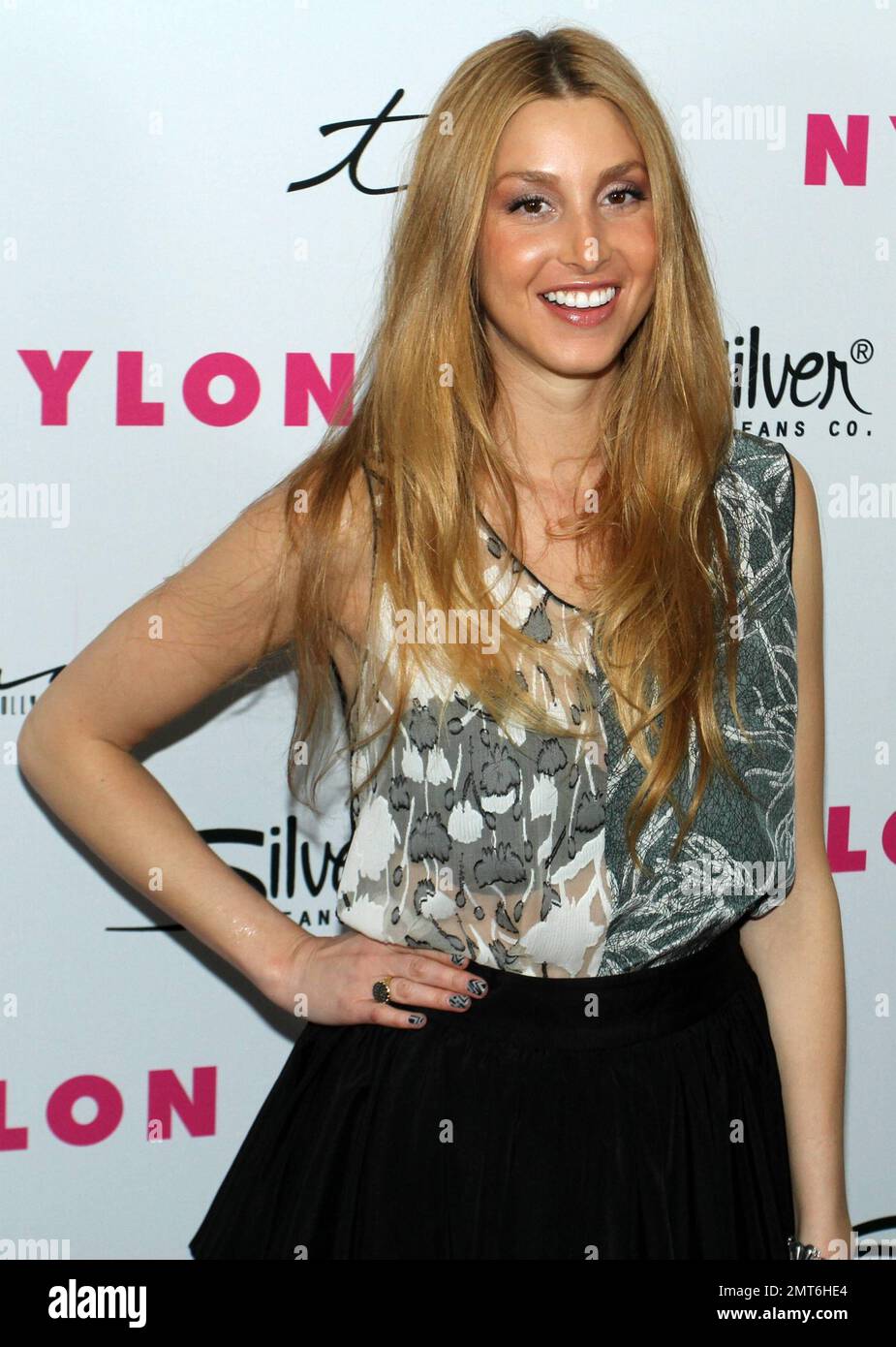 TV personality Whitney Port poses for photographers on the red carpet ...