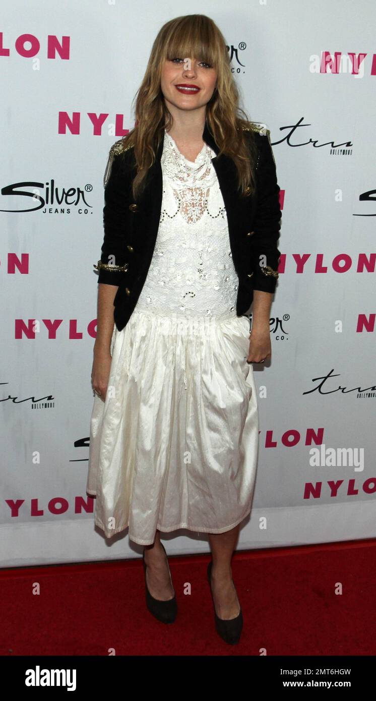 Taryn Manning poses for photographers on the red carpet at NYLON ...