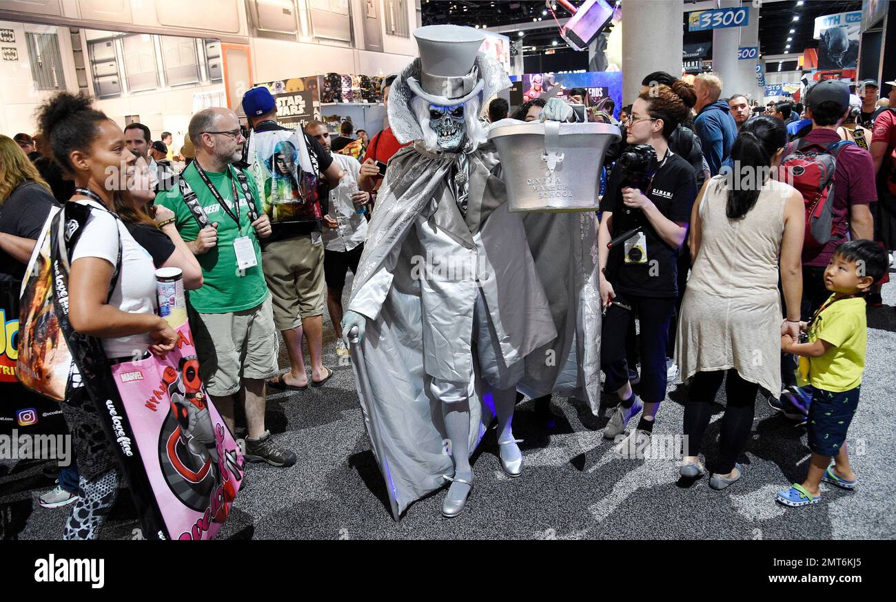 Jose Davalos of the Cinema Makeup School walks through the convention ...