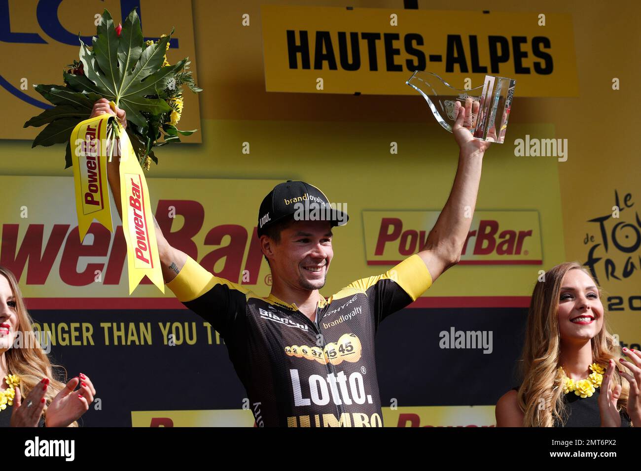 Stage winner Slovenia's Primoz Roglic celebrates on the podium after ...