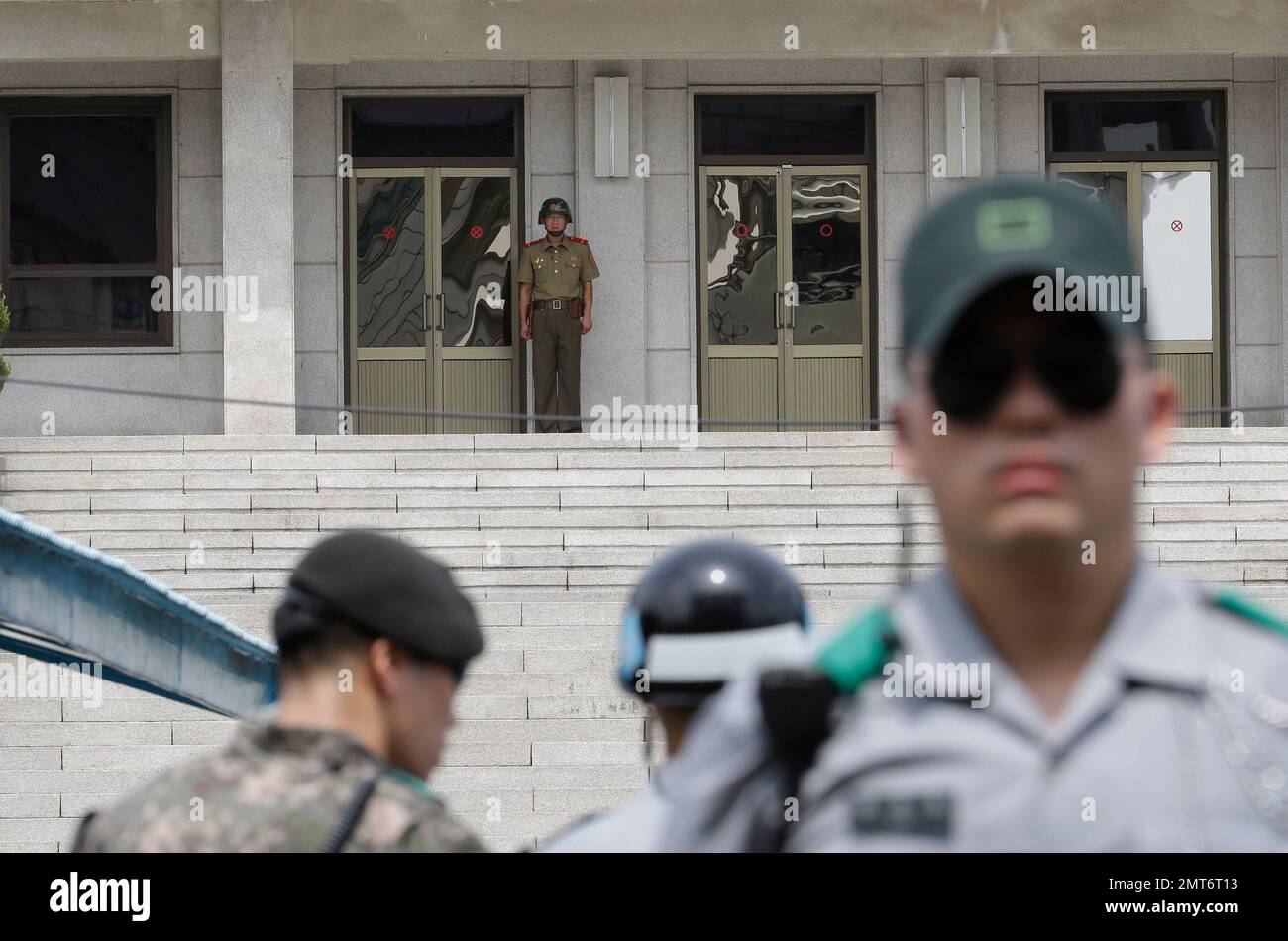 Army soldiers of North Korea, top, and South Korea stand guard at the ...