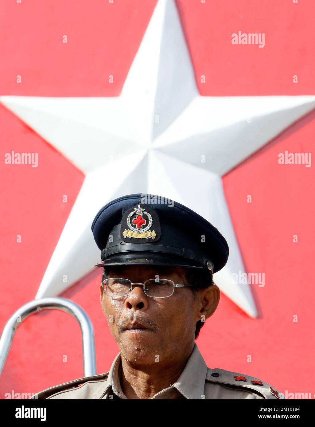 A member of the Myanmar Red Cross salutes the tomb of national hero Gen ...