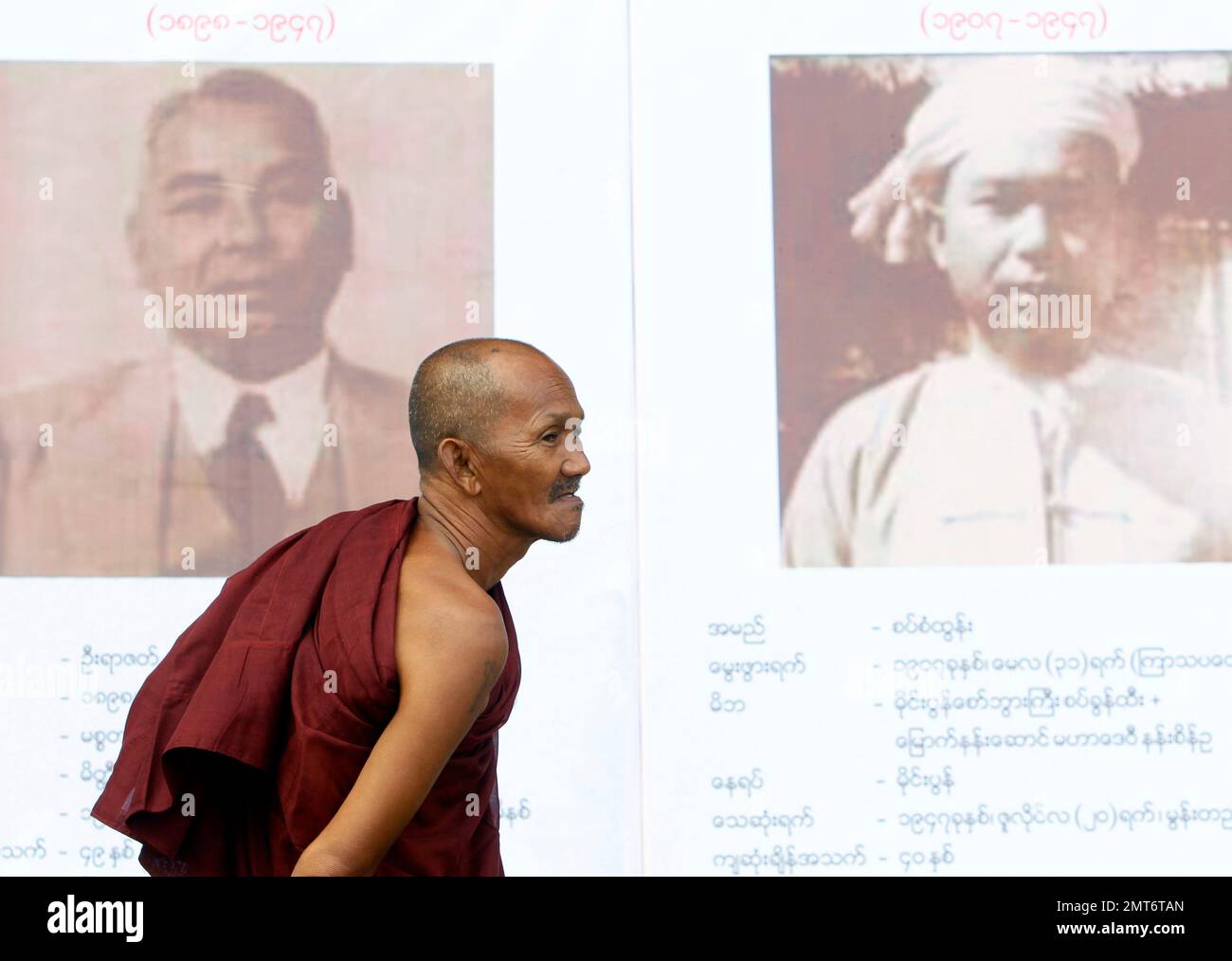 A Buddhist monk views portraits of Myanmar's Independence hero Gen ...