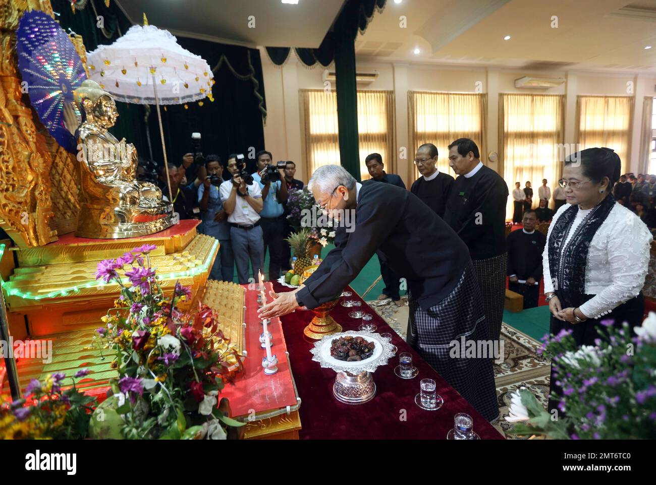 Myanmar President Htin Kyaw, center, and his wife Su Su Lwin, right ...
