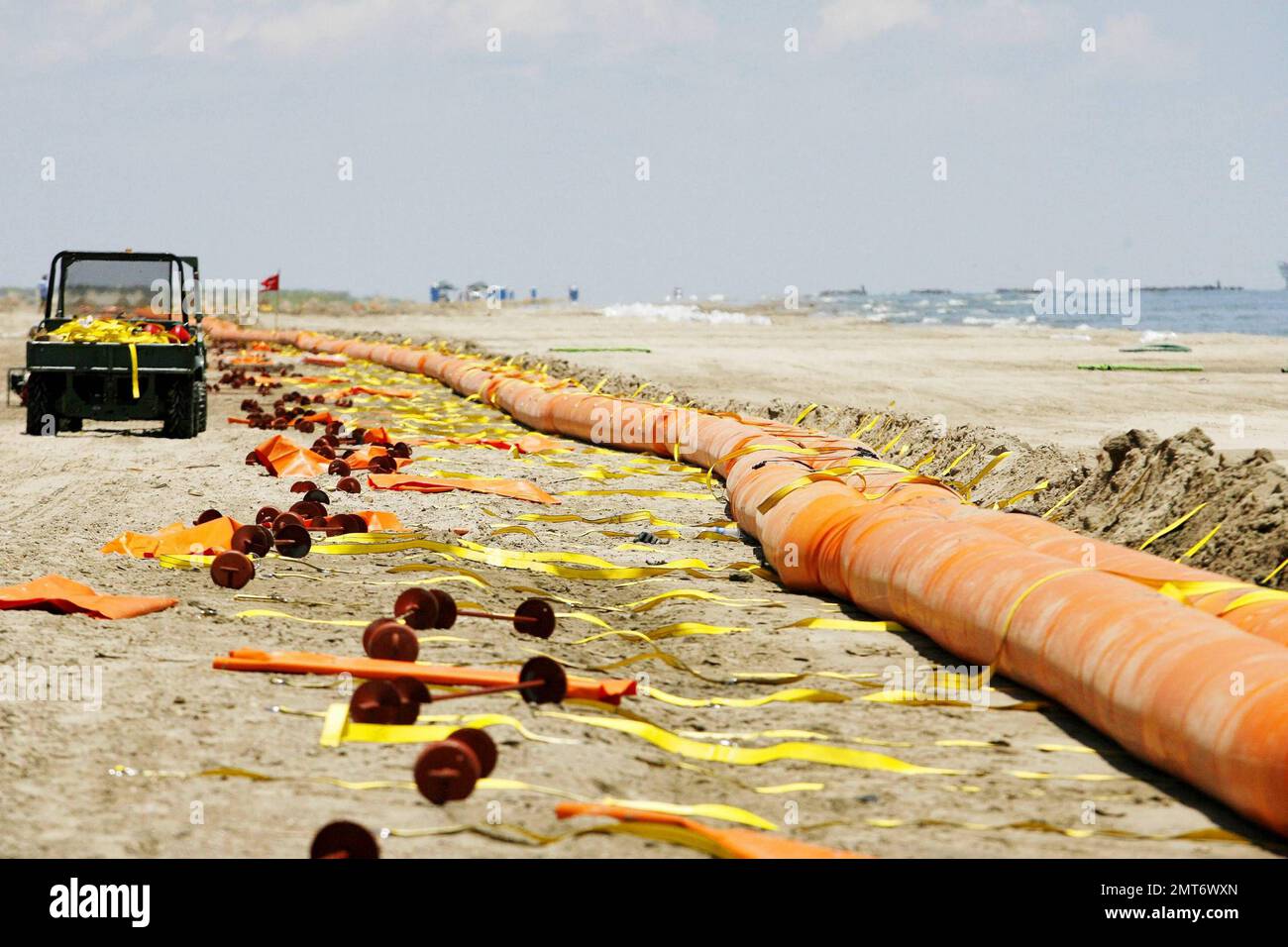Inflatable barricades are installed by the National Guard on the beach ...