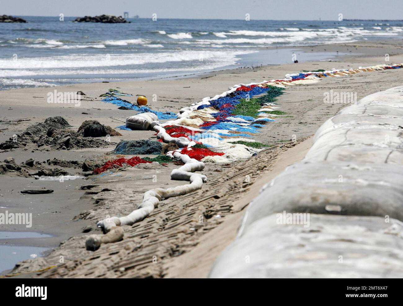 Pom-poms are used to absorb oil in Grand Isle, Louisiana, the site of ...