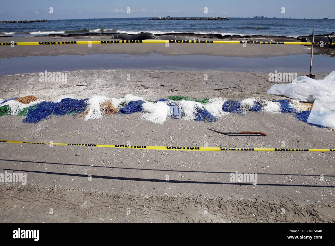 Pom-poms are used to absorb oil in Grand Isle, Louisiana, the site of ...