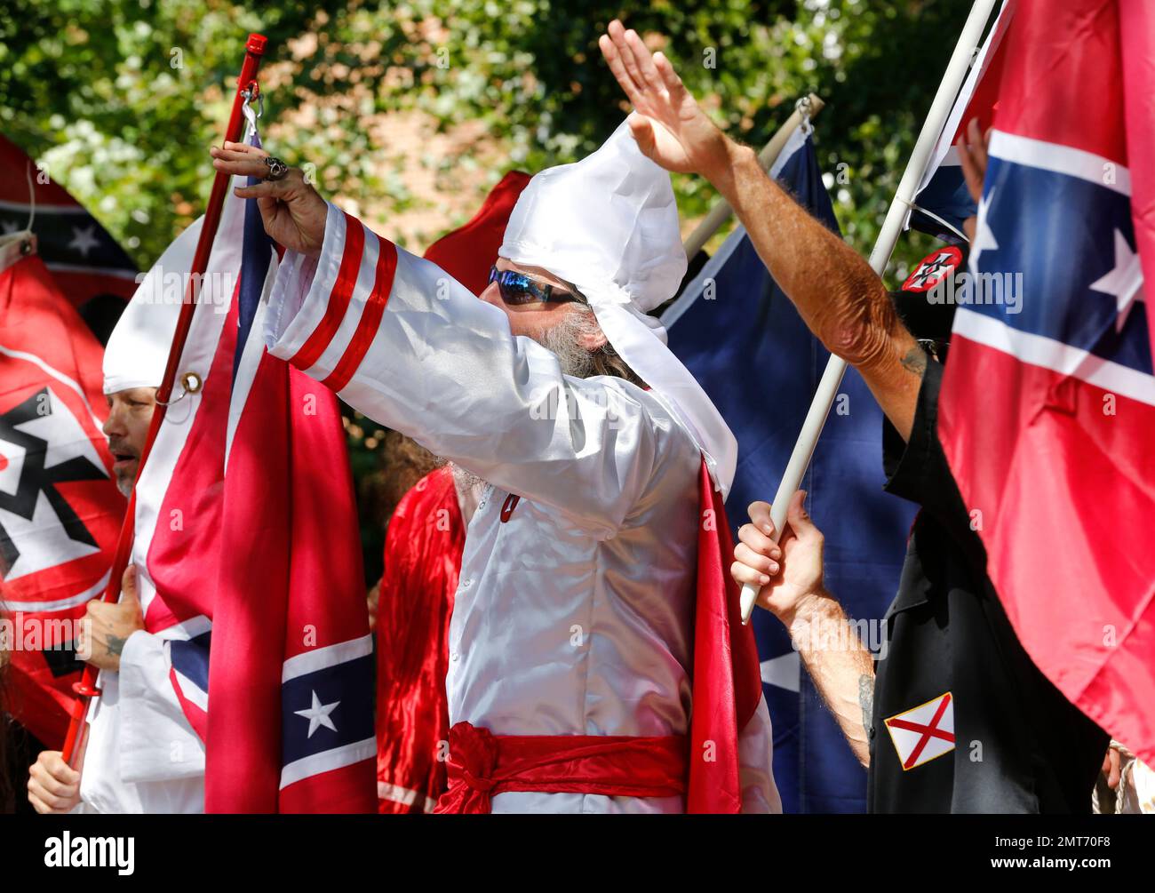 Klan members salute during a KKK rally in Justice Park Saturday, July 8 ...