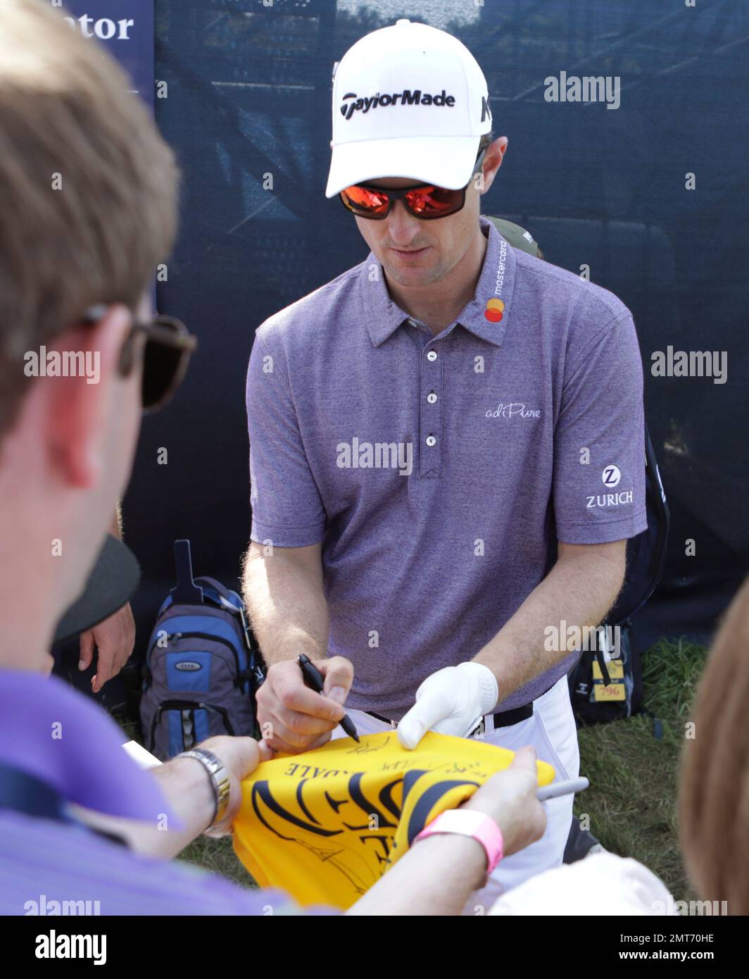 Britain's Justin Rose signs an autograph during a practice round ahead ...