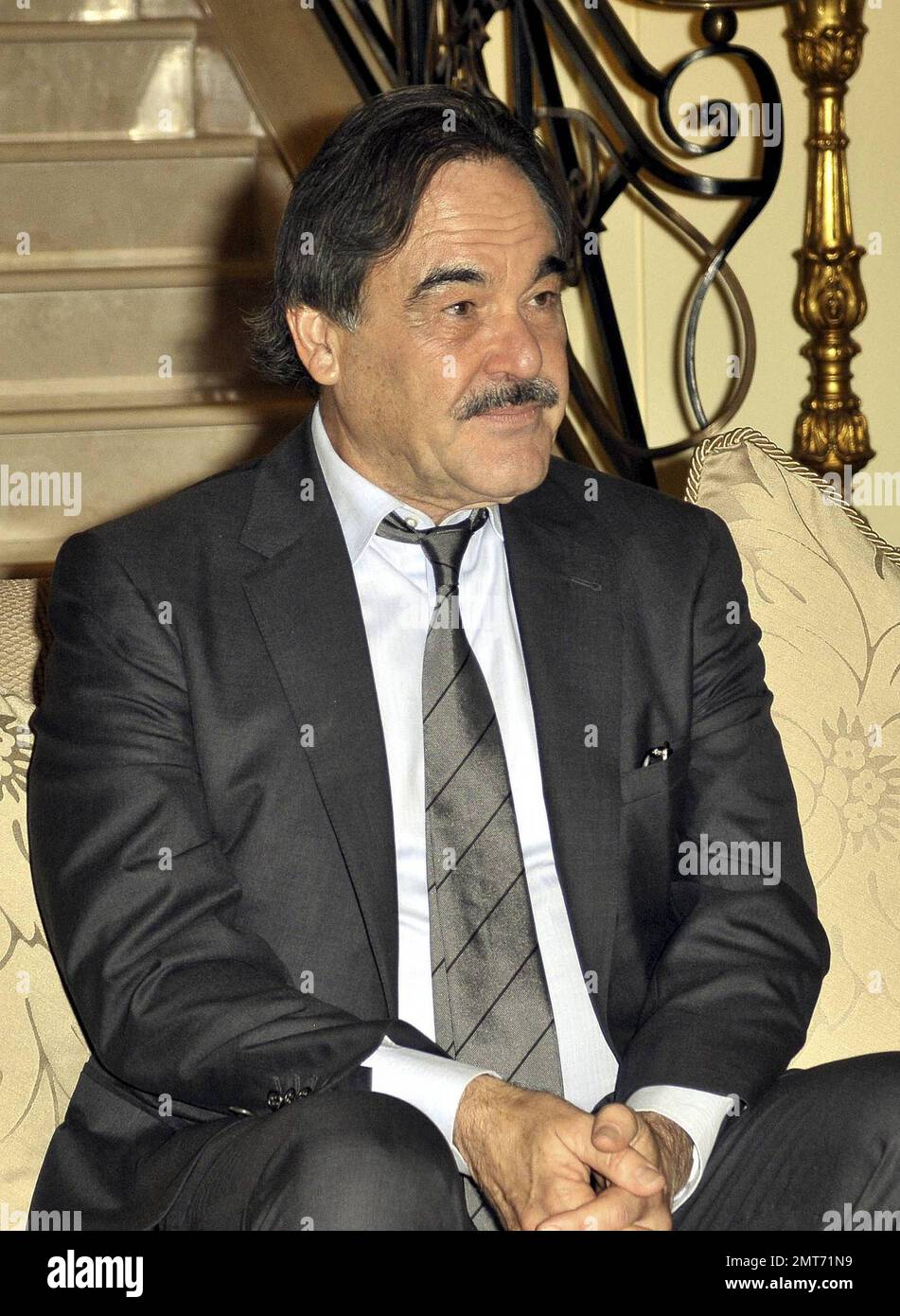 Oliver Stone poses for photos during a photocall for his new film "Wall ...