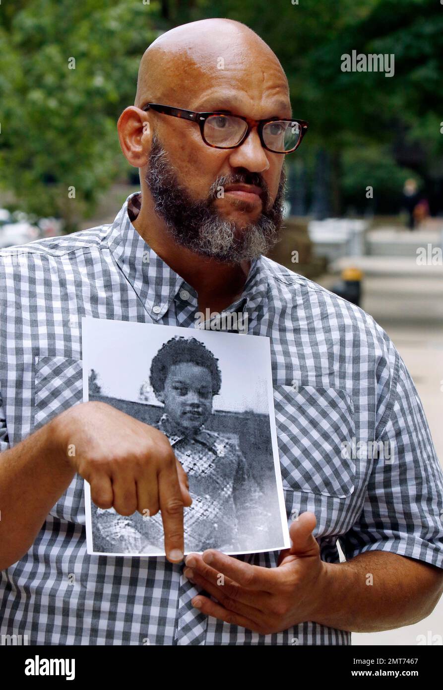 Andre Jones, of New York, speaks outside the Suffolk County Courthouse ...